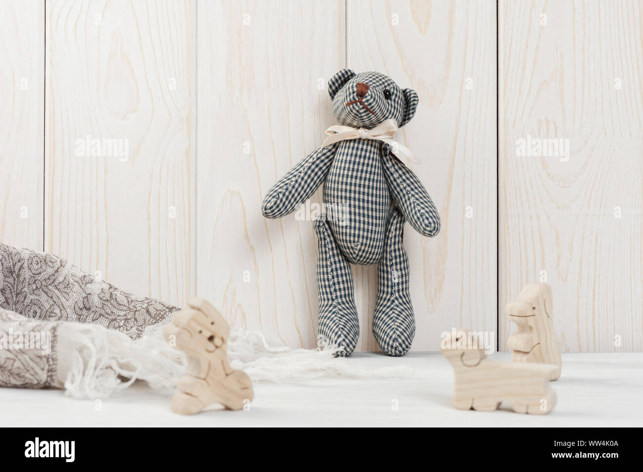Cute teddy bear on wooden background with wooden baby toys Stock Photo ...