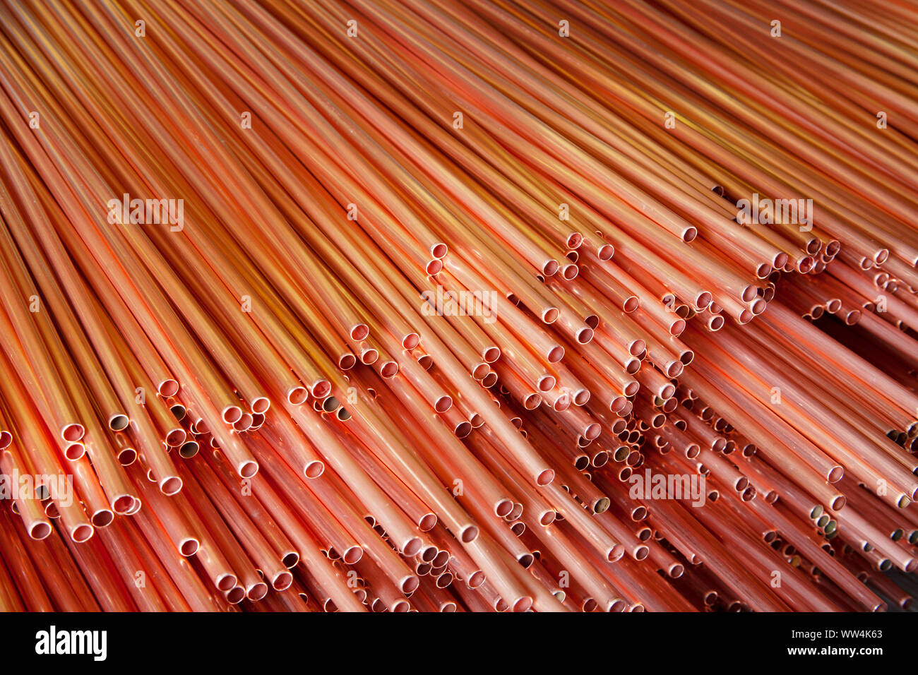 Copper pipes in factory, industrial background Stock Photo - Alamy