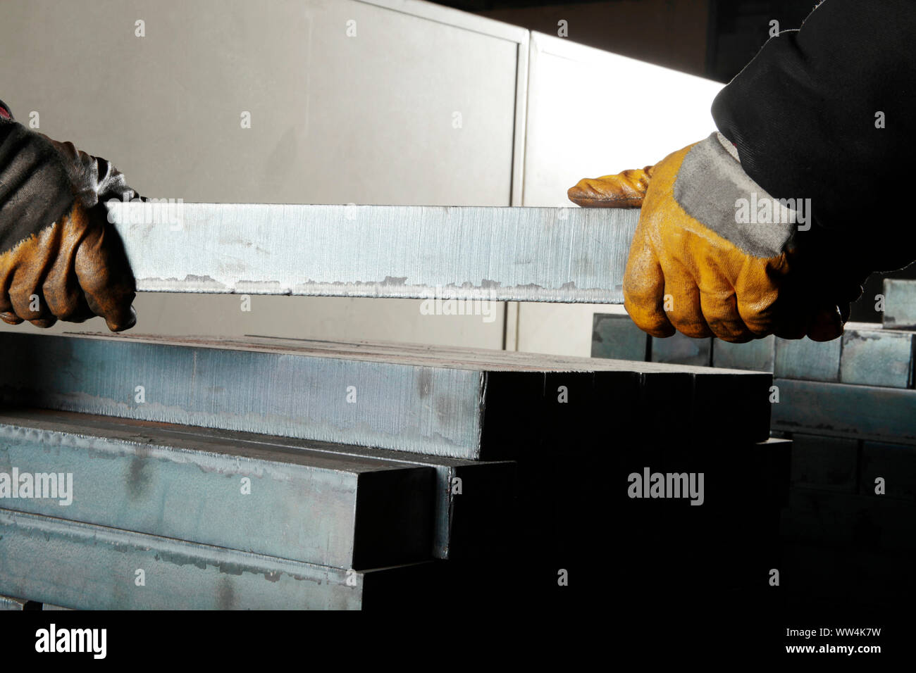 workers and heavy metal blocks Stock Photo - Alamy