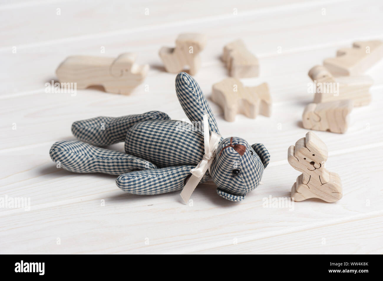 Cute teddy bear on wooden background with wooden baby toys Stock Photo ...