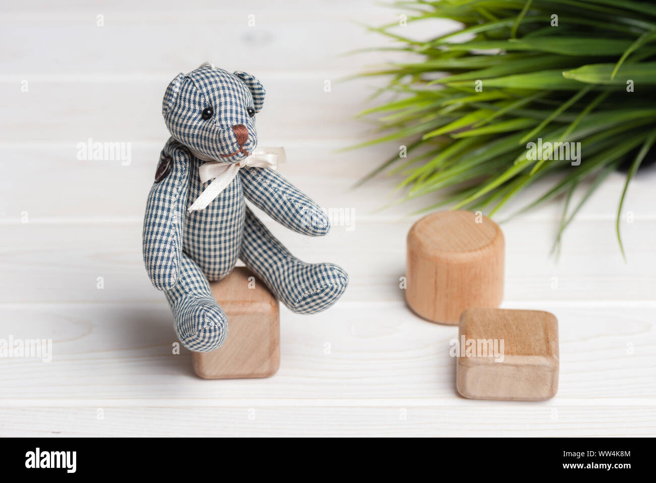 Cute teddy bear on wooden background with wooden baby toys Stock Photo ...