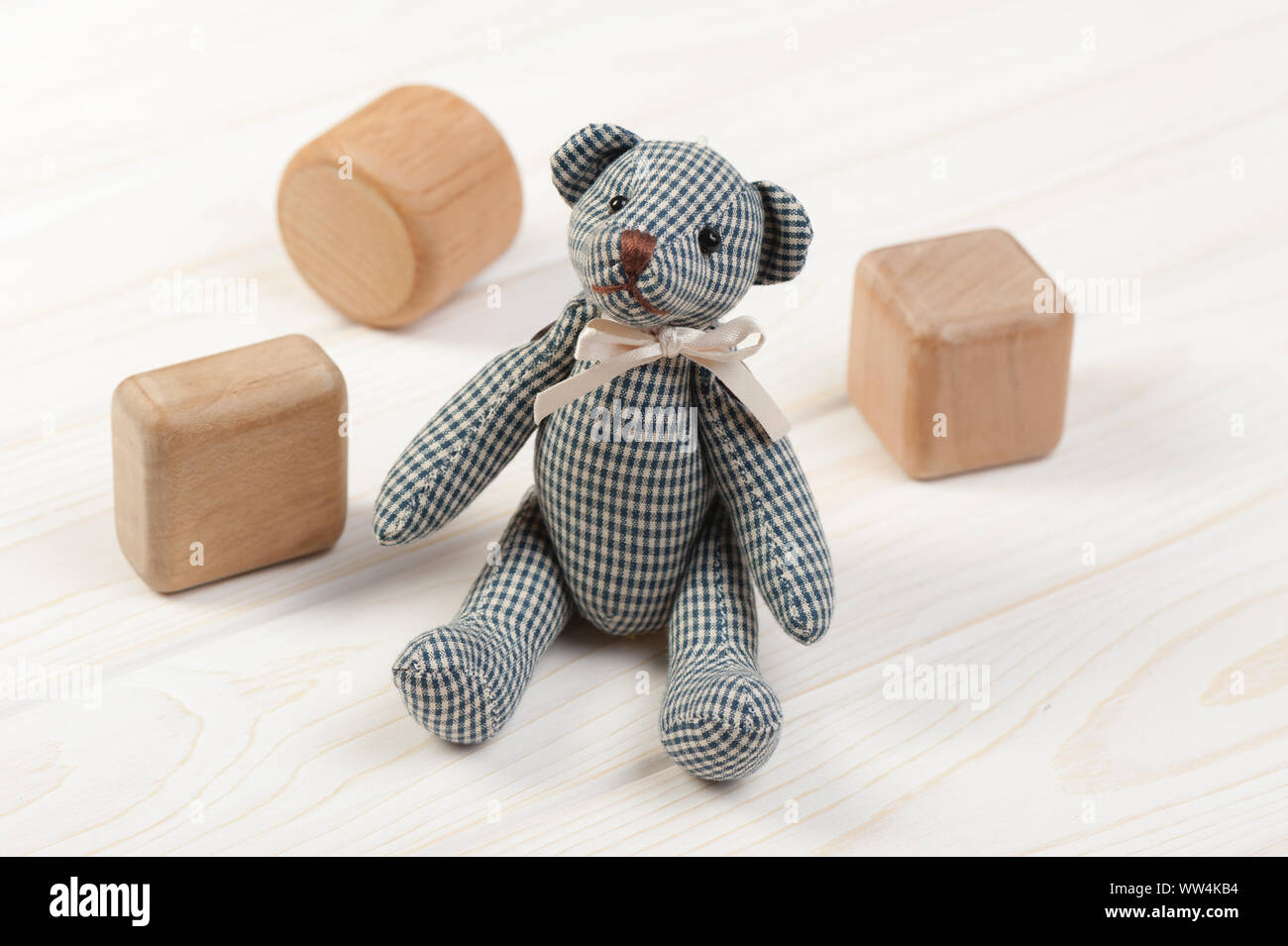 Cute teddy bear on wooden background with wooden baby toys Stock Photo ...