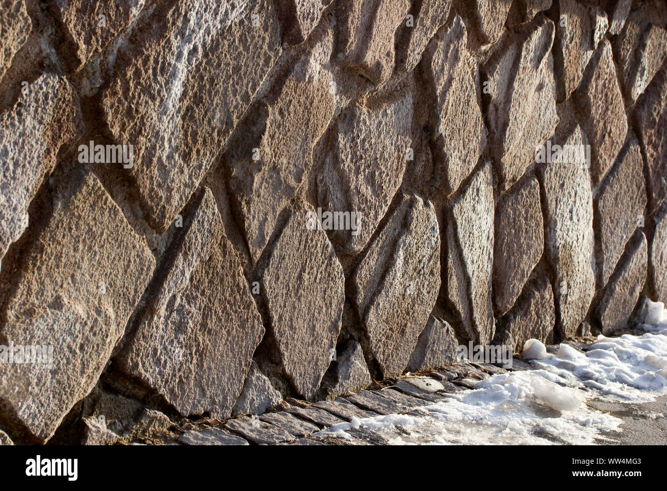 stone wall and snow background Stock Photo - Alamy