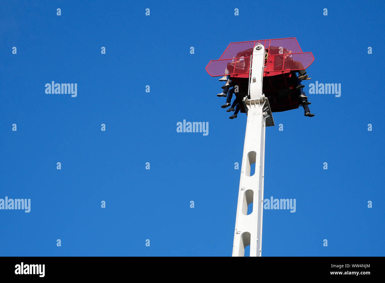 People enjoying ride on free fall attraction in lunapark Stock Photo ...
