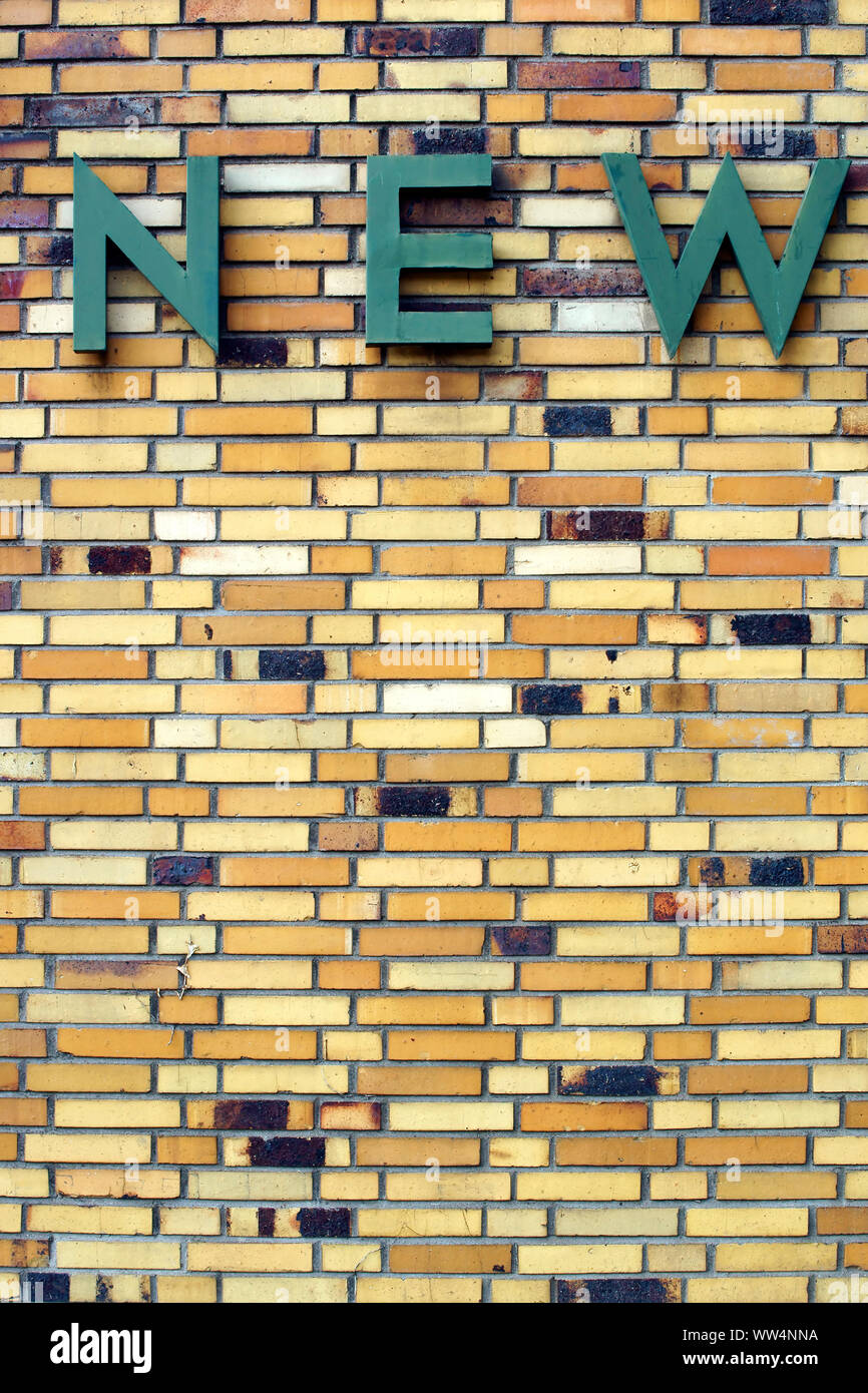 Photography of an old and striking brick wall with a sign from single ...