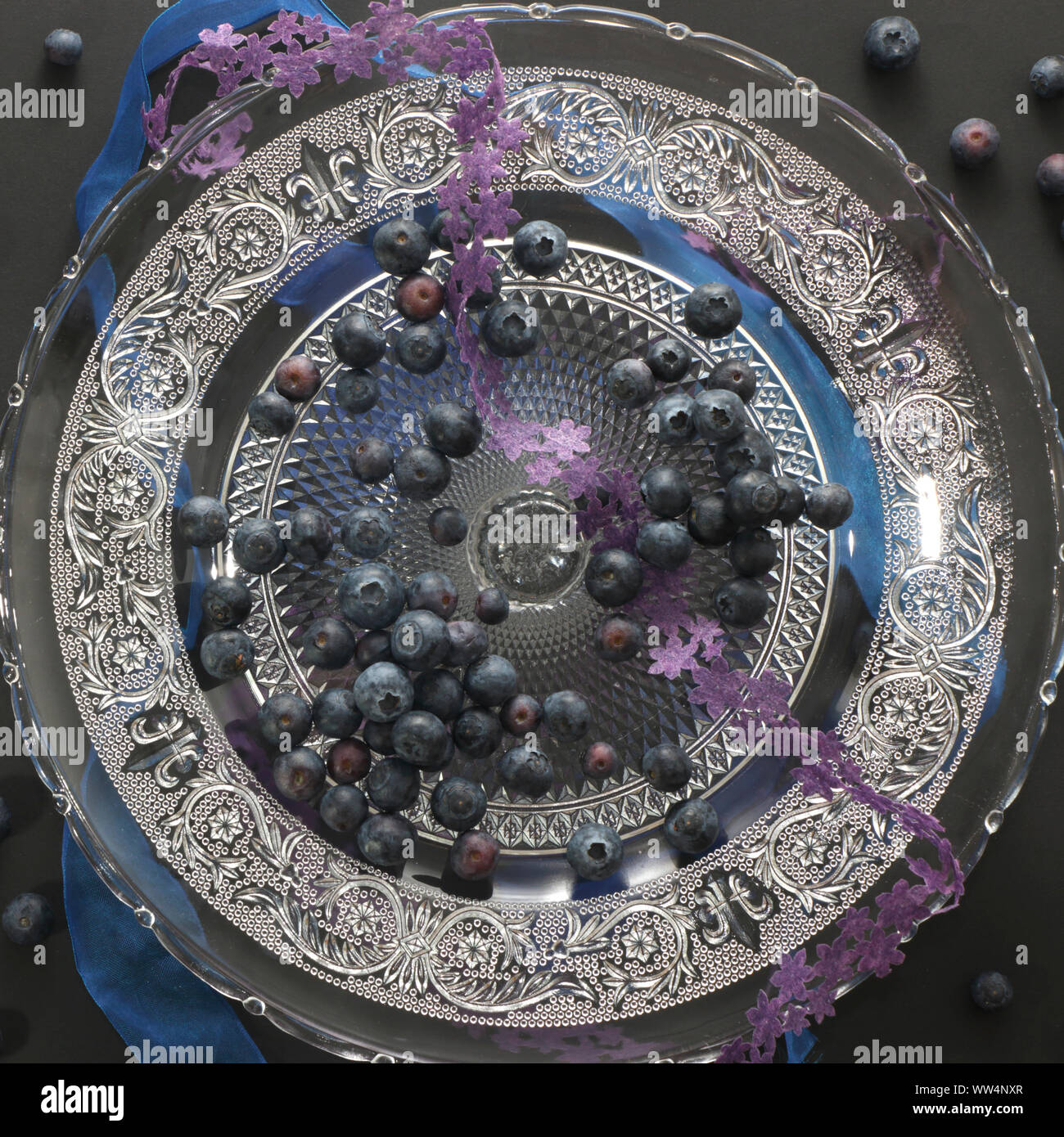 Garden blueberries on antique plate Stock Photo - Alamy