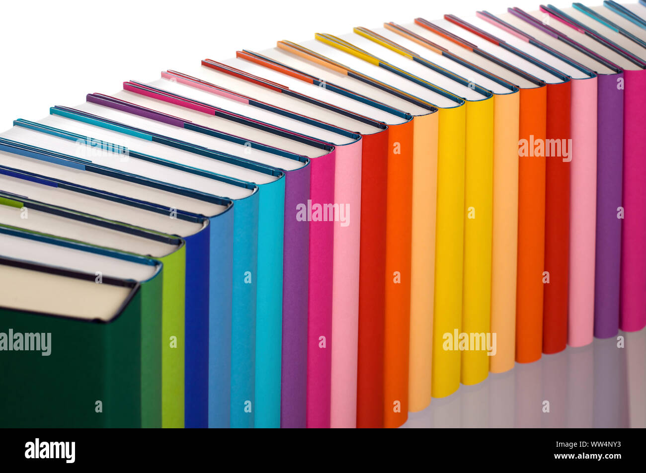 Close-up of rainbow-colored book arrangement Stock Photo - Alamy