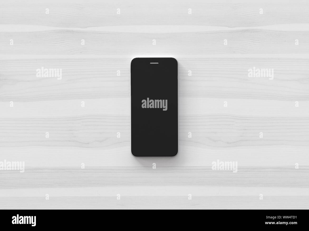 Modern smartphone black color with blank screen isolated on bright ...