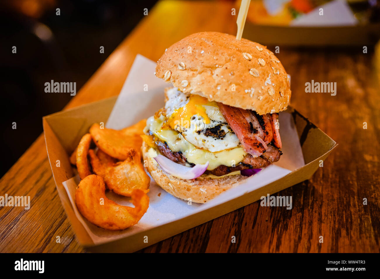 Burger set in a cozy restaurant, Adelaide Stock Photo - Alamy