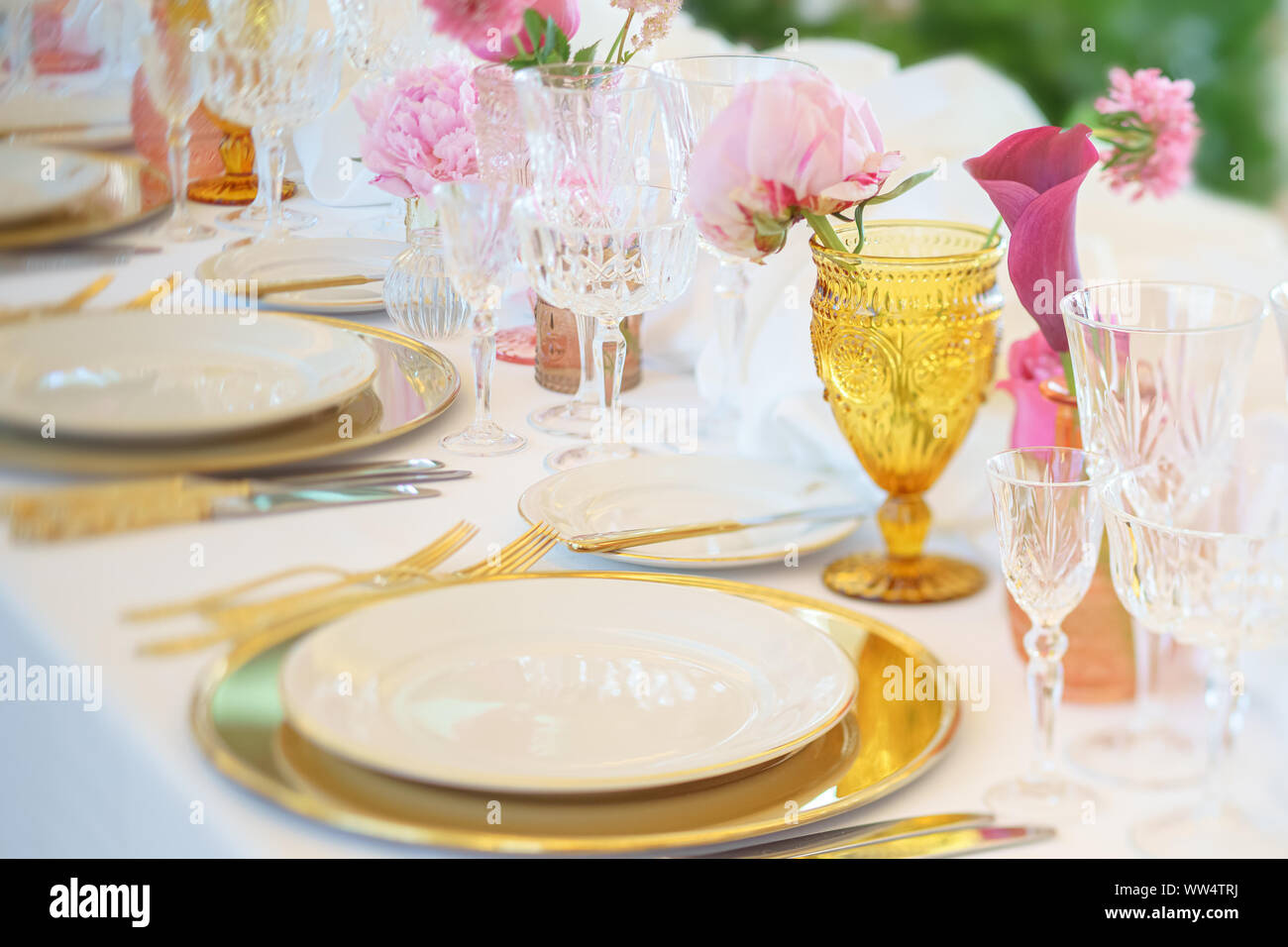 Catering table set service with silverware, napkin and glass at ...