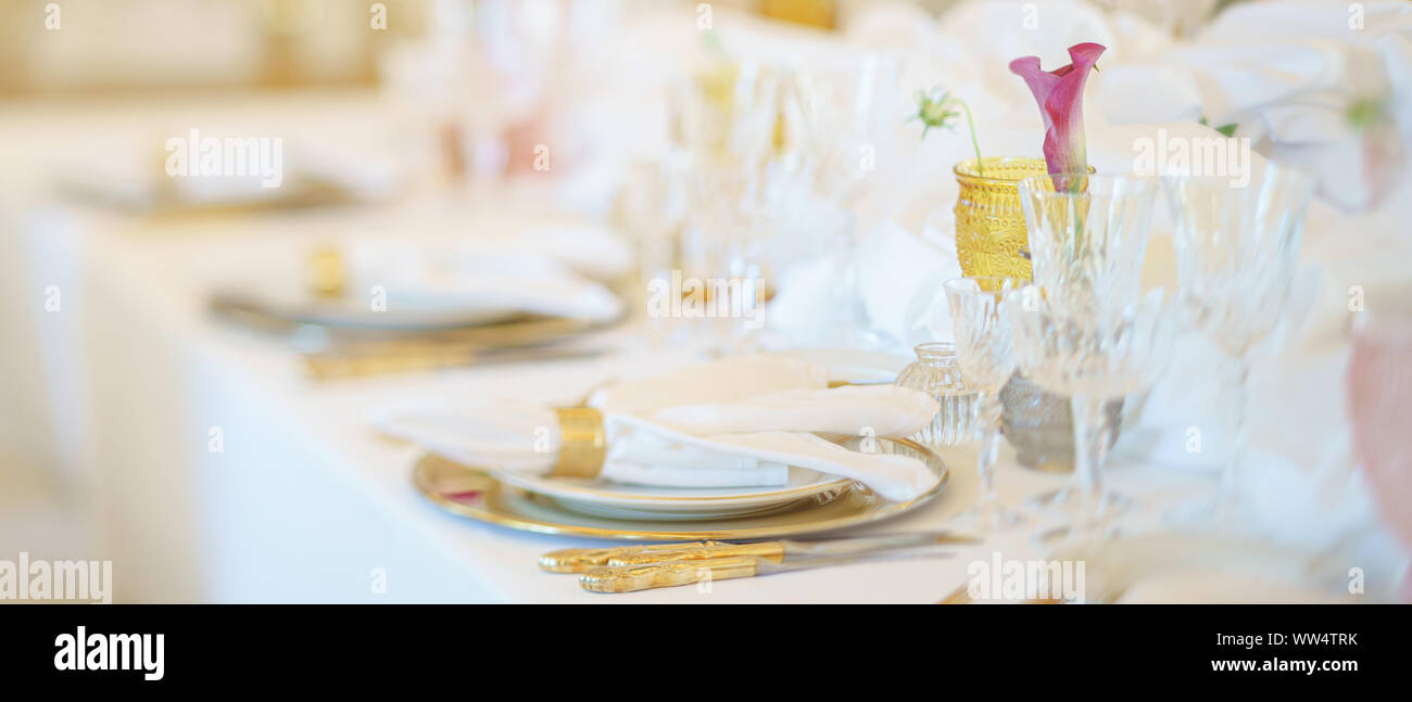 Catering table set service with silverware, napkin and glass at ...
