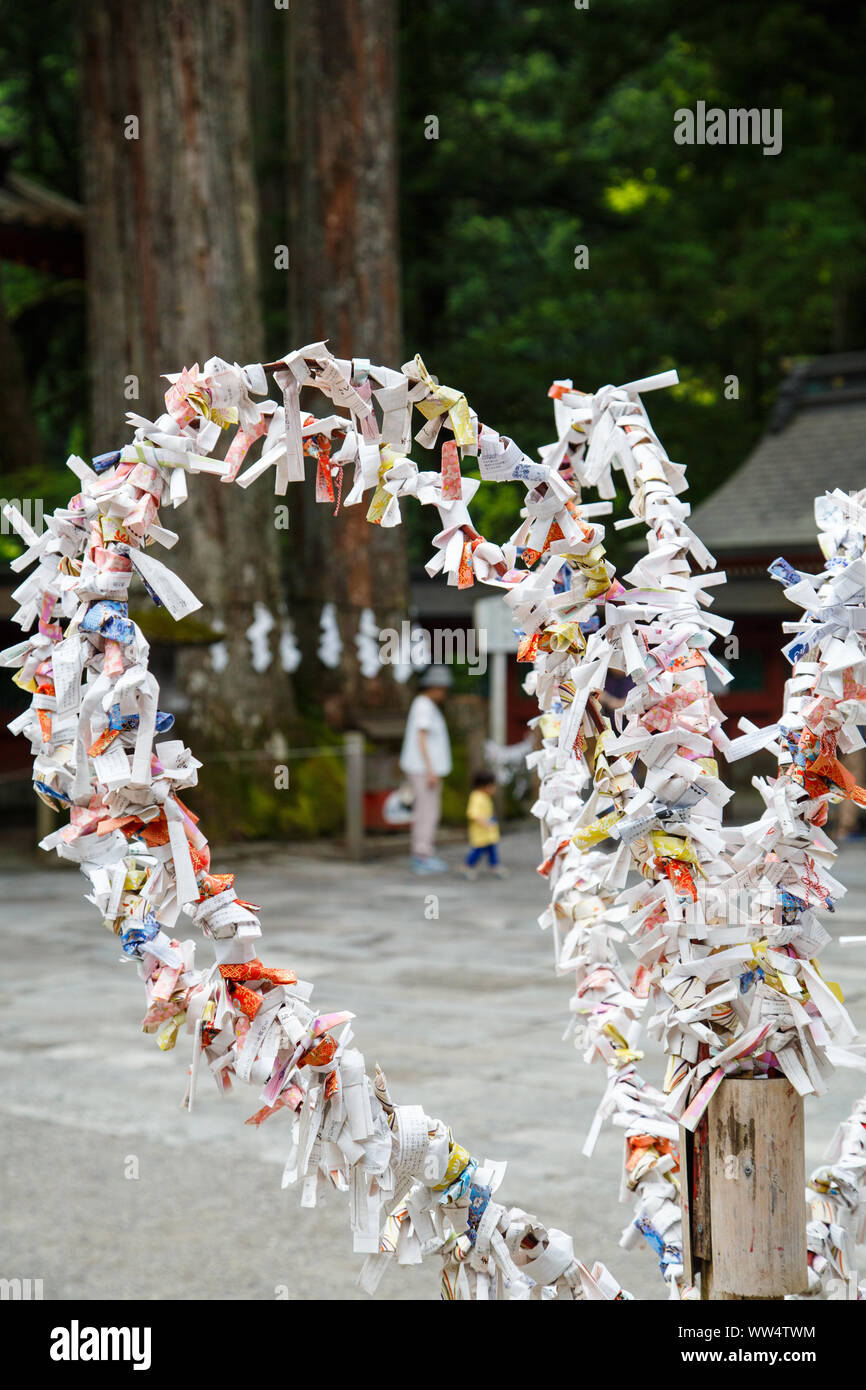 Nikko, Japan. The heart shaped pole his decorated with prayer ribbons ...