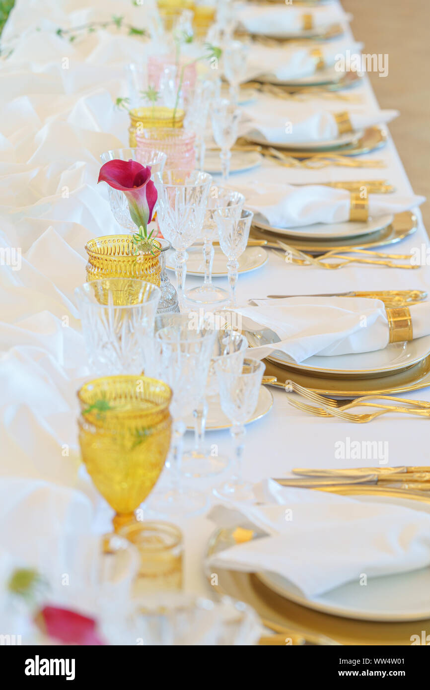 Catering table set service with silverware, napkin and glass at ...