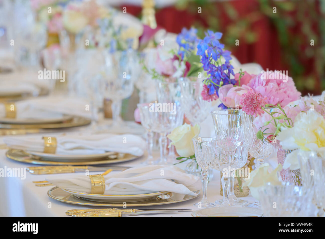 Catering table set service with silverware, napkin and glass at ...