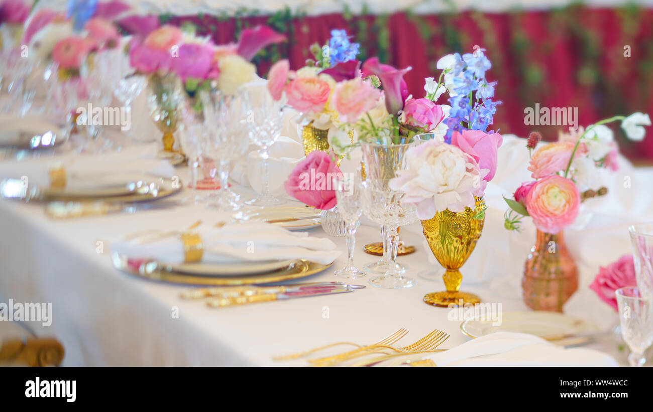 Catering table set service with silverware, napkin and glass at ...