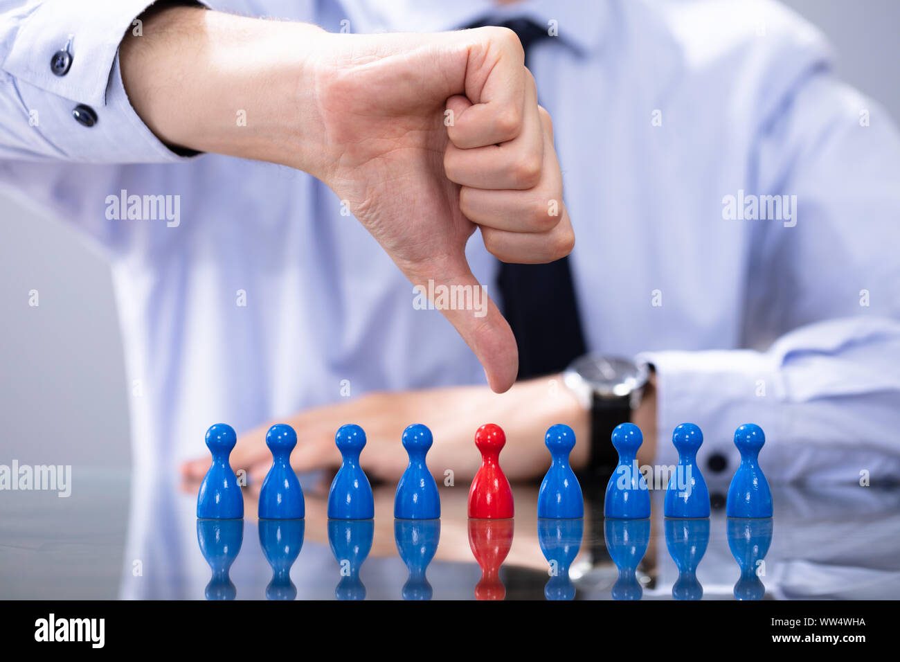 Workplace Discrimination Concept. Hand Showing Thumbs Down Near Red ...