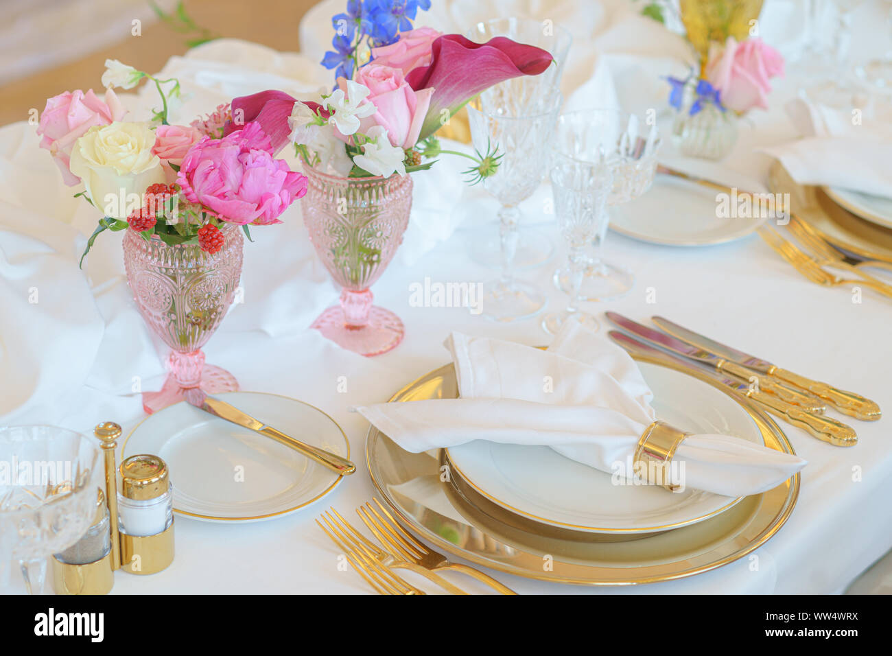 Catering table set service with silverware, napkin and glass at ...