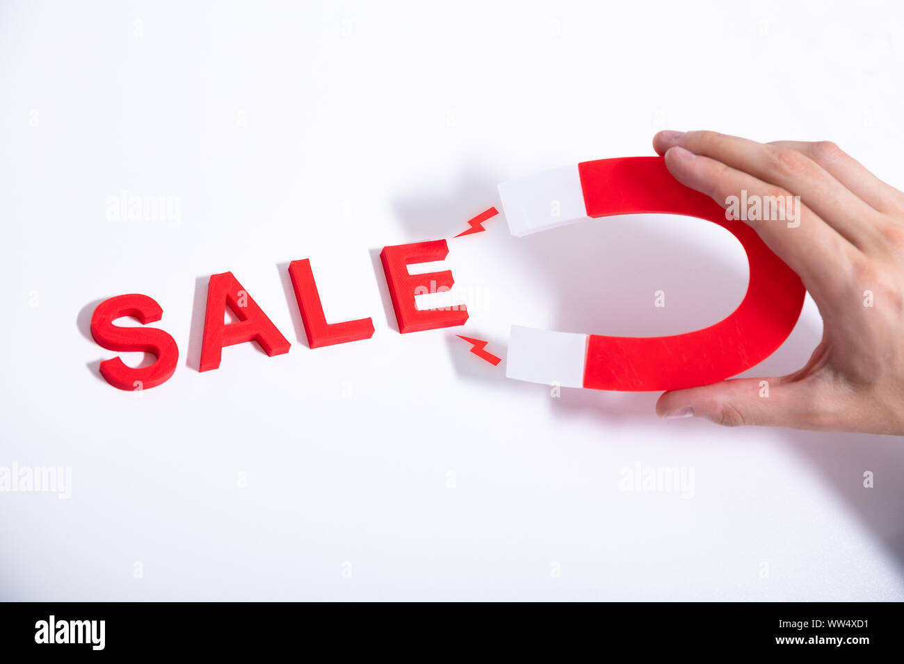 Businessperson Attracting More Sales With Horseshoe Magnet Stock Photo ...