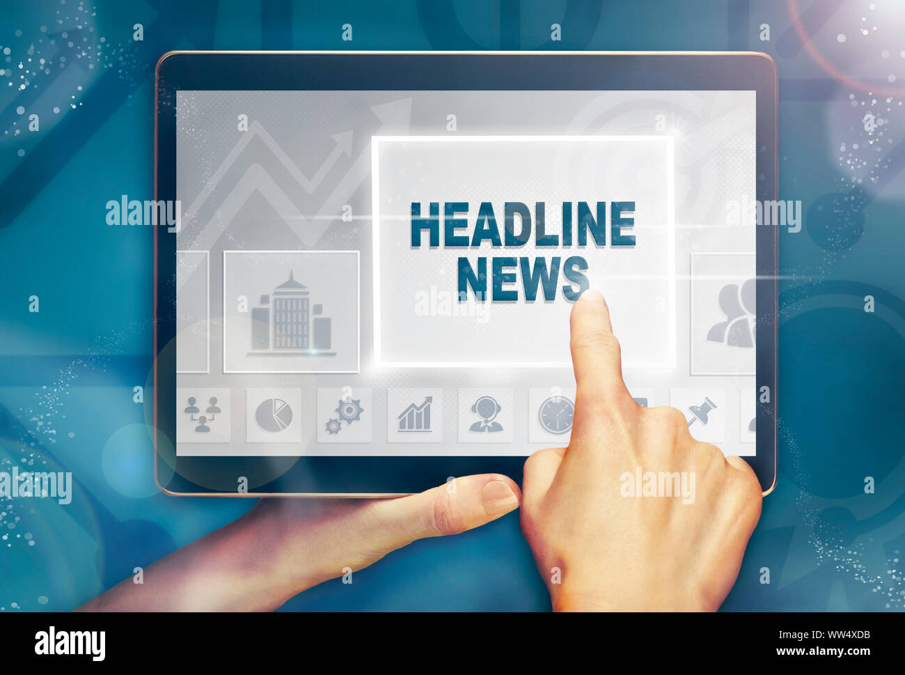 A hand selecting a Headline News business concept on a computer tablet ...