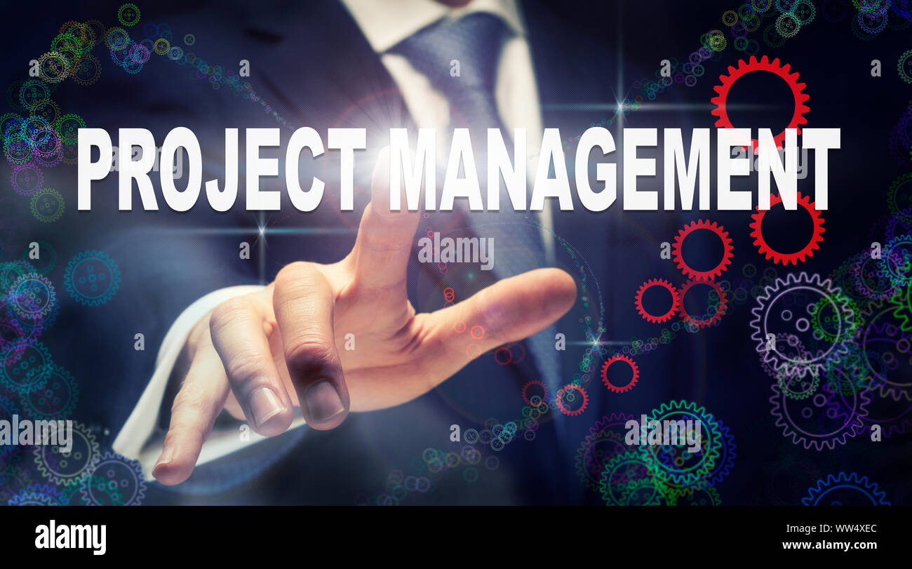 A businessman pressing a Project Management business concept on a ...