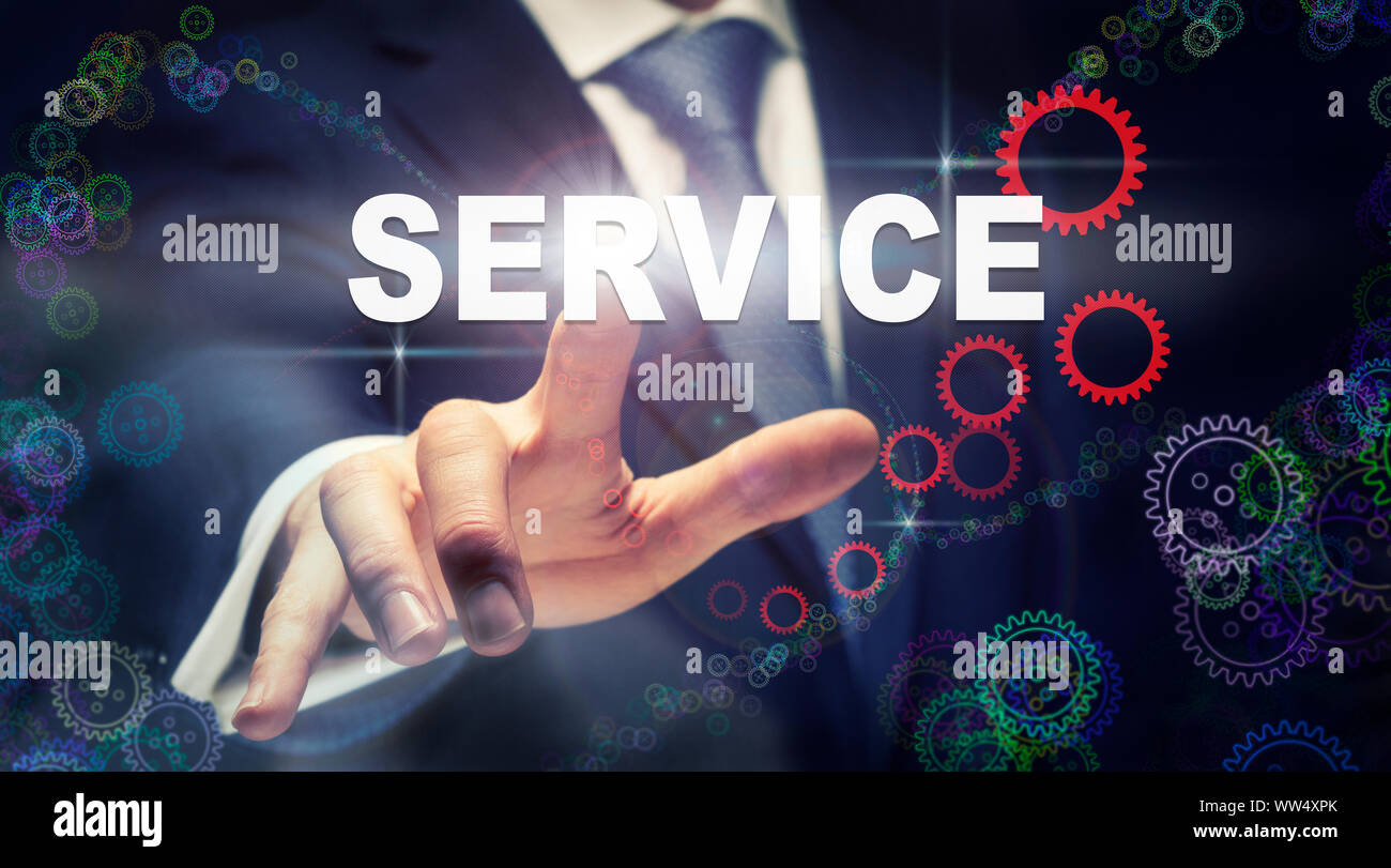 A businessman pressing a Service business concept on a graphical ...