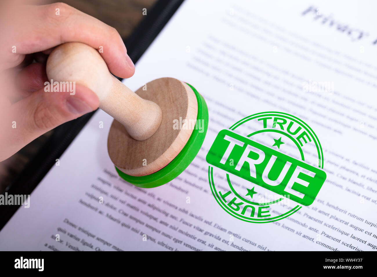 Businessman Hand Putting True Stamp On Document Stock Photo - Alamy