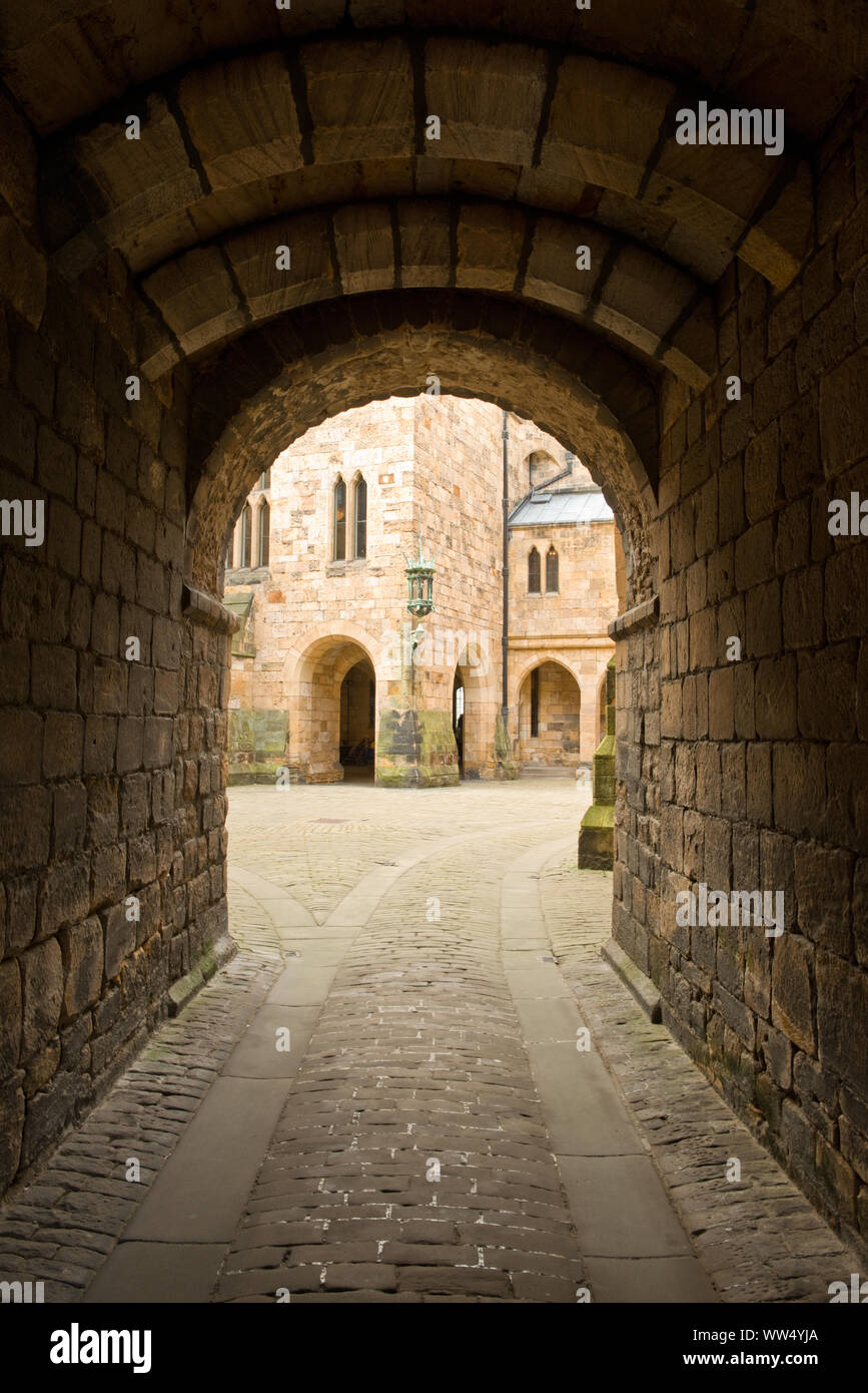 Gate archway into Alnwick Castle courtyard. Northumberland, England ...