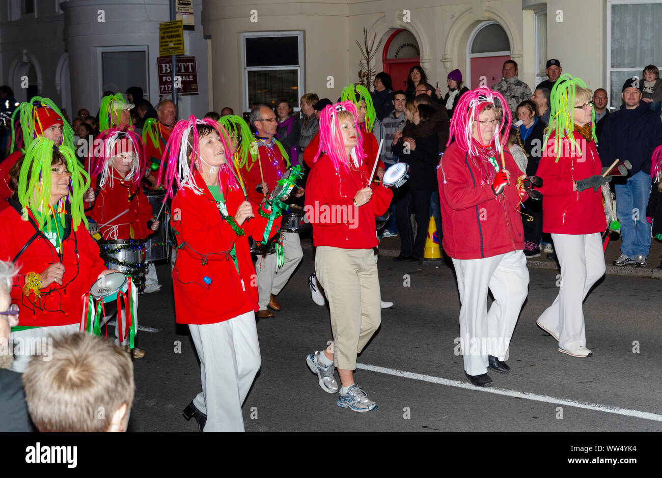 Women dressed in fancy dress marching in a procession while at a Guy ...
