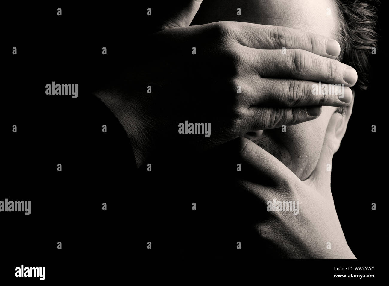 Avoidance, man covering his face Stock Photo - Alamy