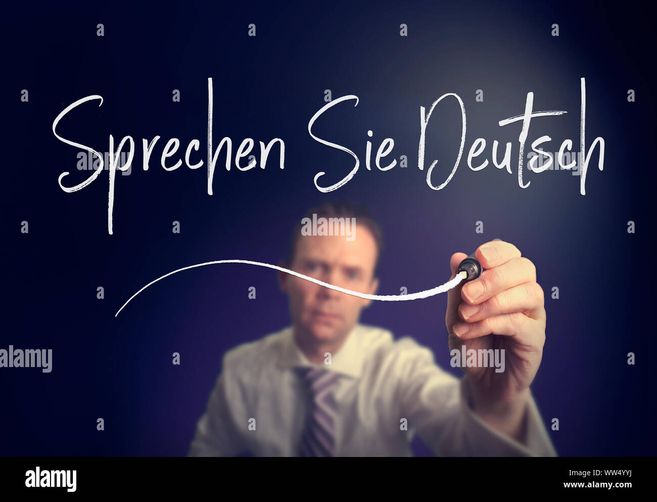 A businessman writing a Do You Speak German "Sprechen Sie Deutsch ...