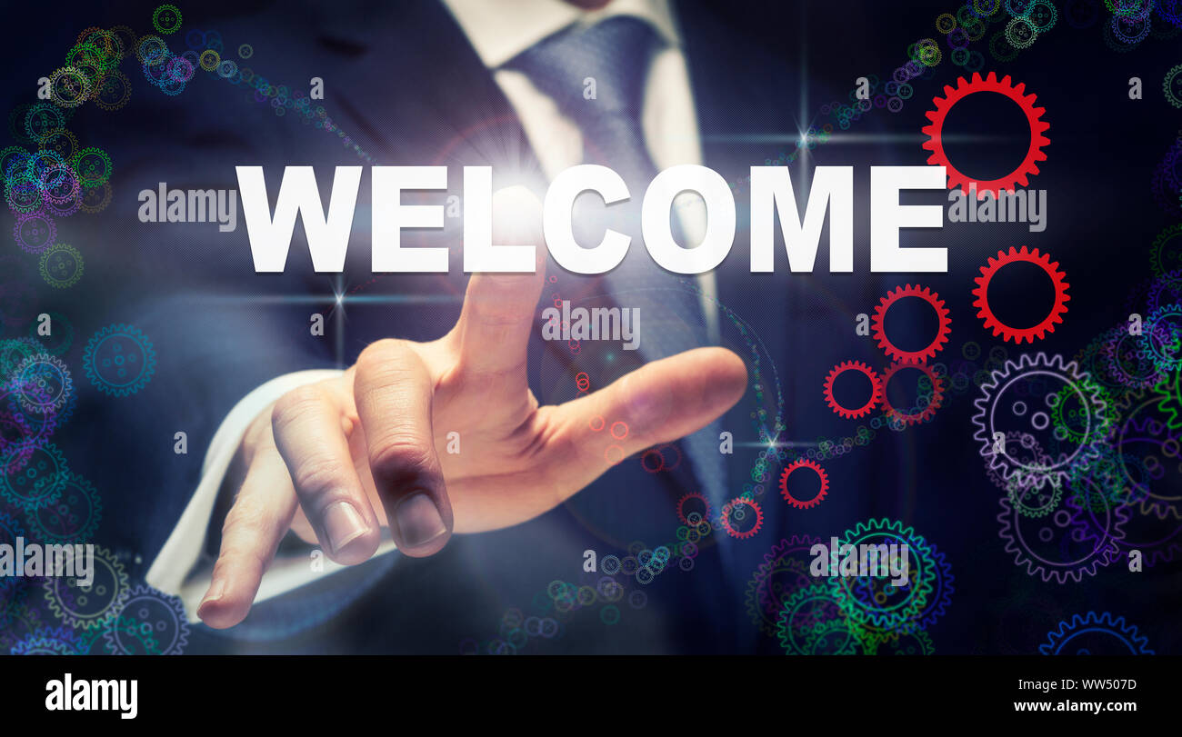A businessman pressing a Welcome business concept on a graphical ...