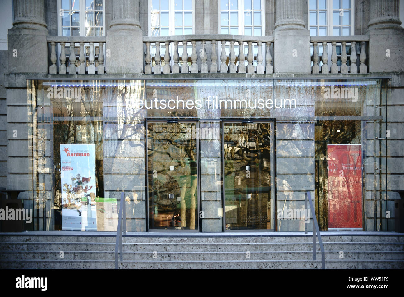Glass entrance of the german film museum with posters hi-res stock ...