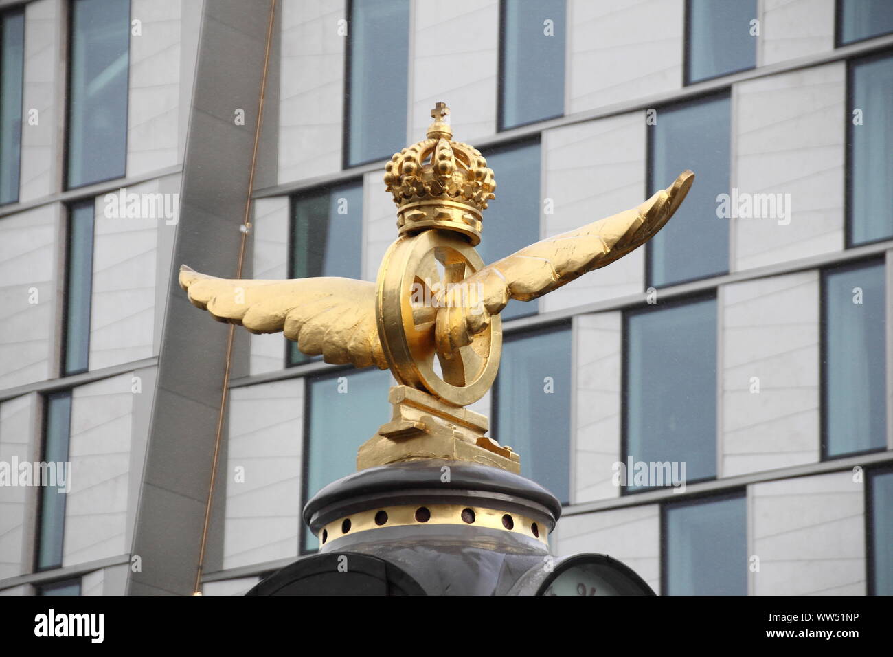Golden crown with wings on a clock in stockholm hi-res stock ...