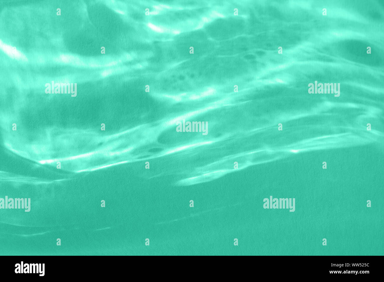 Trendy mint colored abstract background with light and shadows caustic ...