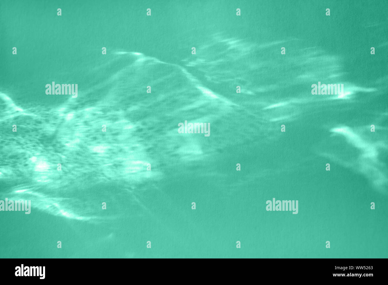 Trendy mint colored abstract background with light and shadows caustic ...