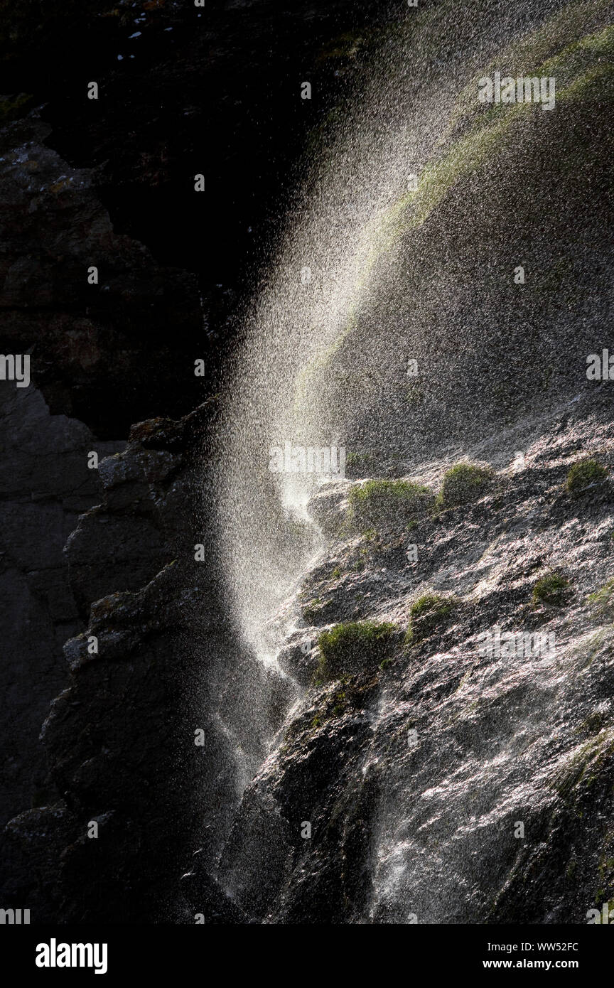 Ireland, County Clare, rocky coast at the Loop peninsula, waterfall ...