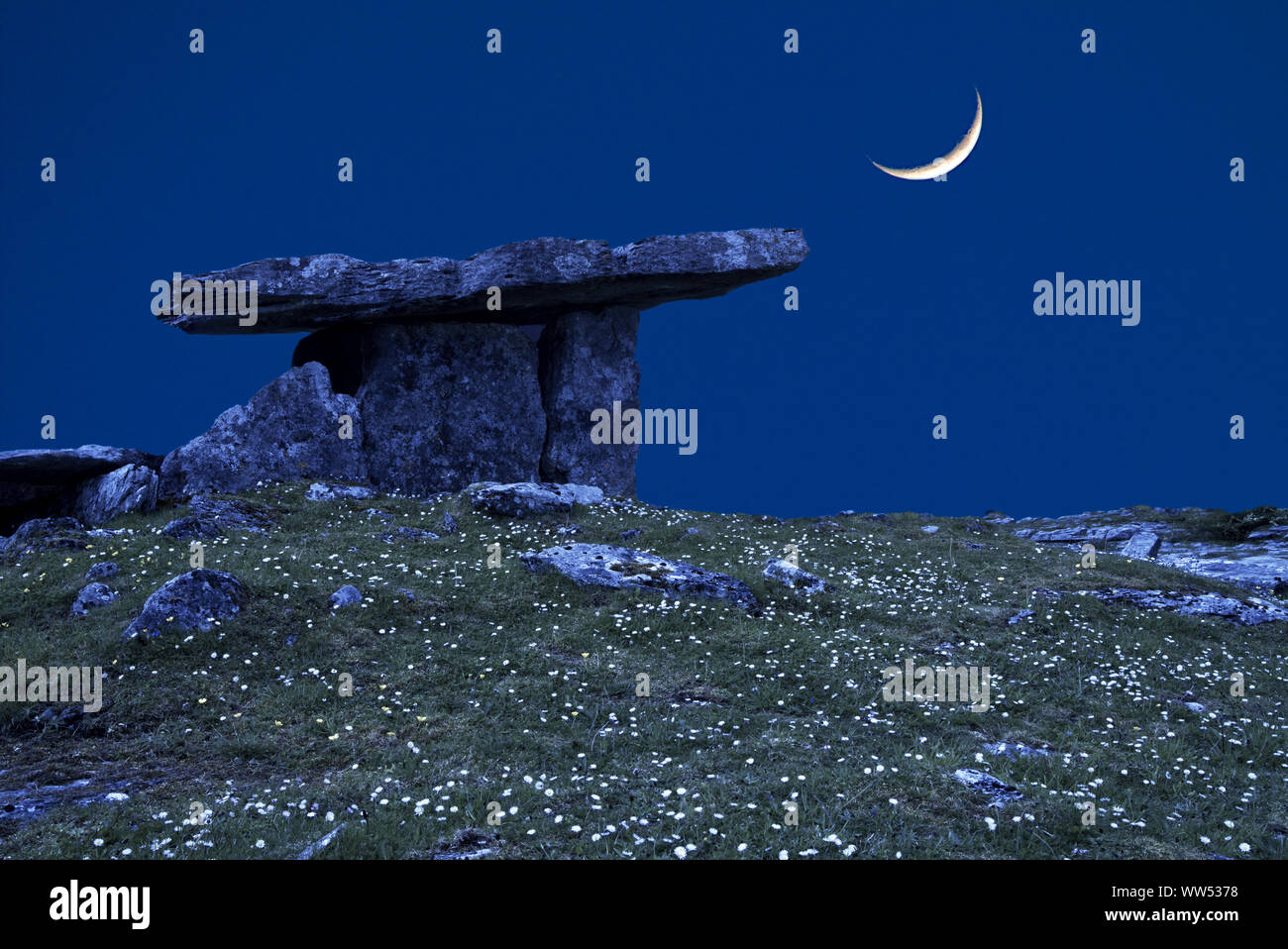 Ireland, County Clare, moon above Poulnabrone Dolmen near Lisdoonvarna ...