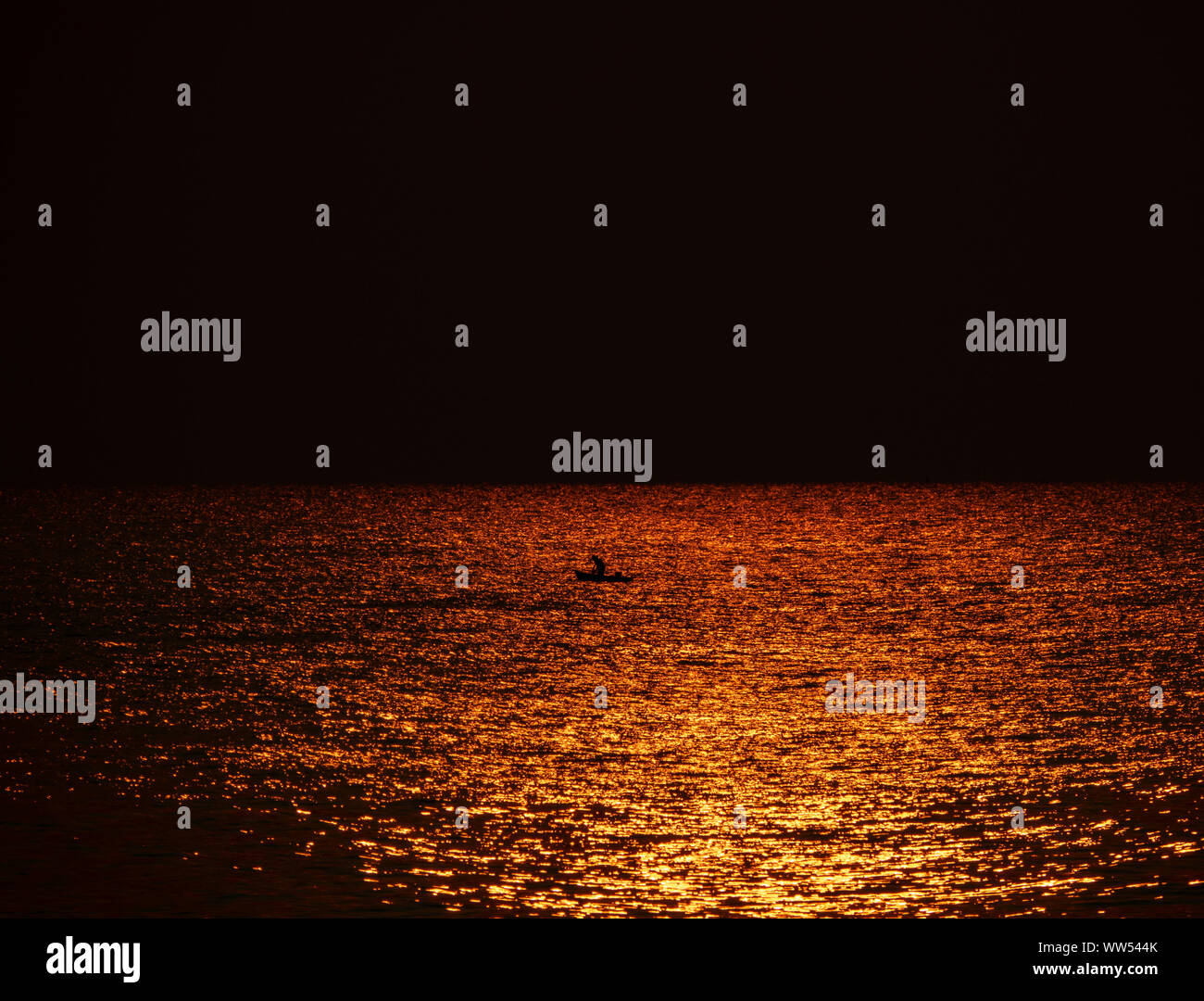 Fisherman fishing at sunrise in Malawi lake, high contrast Stock Photo ...