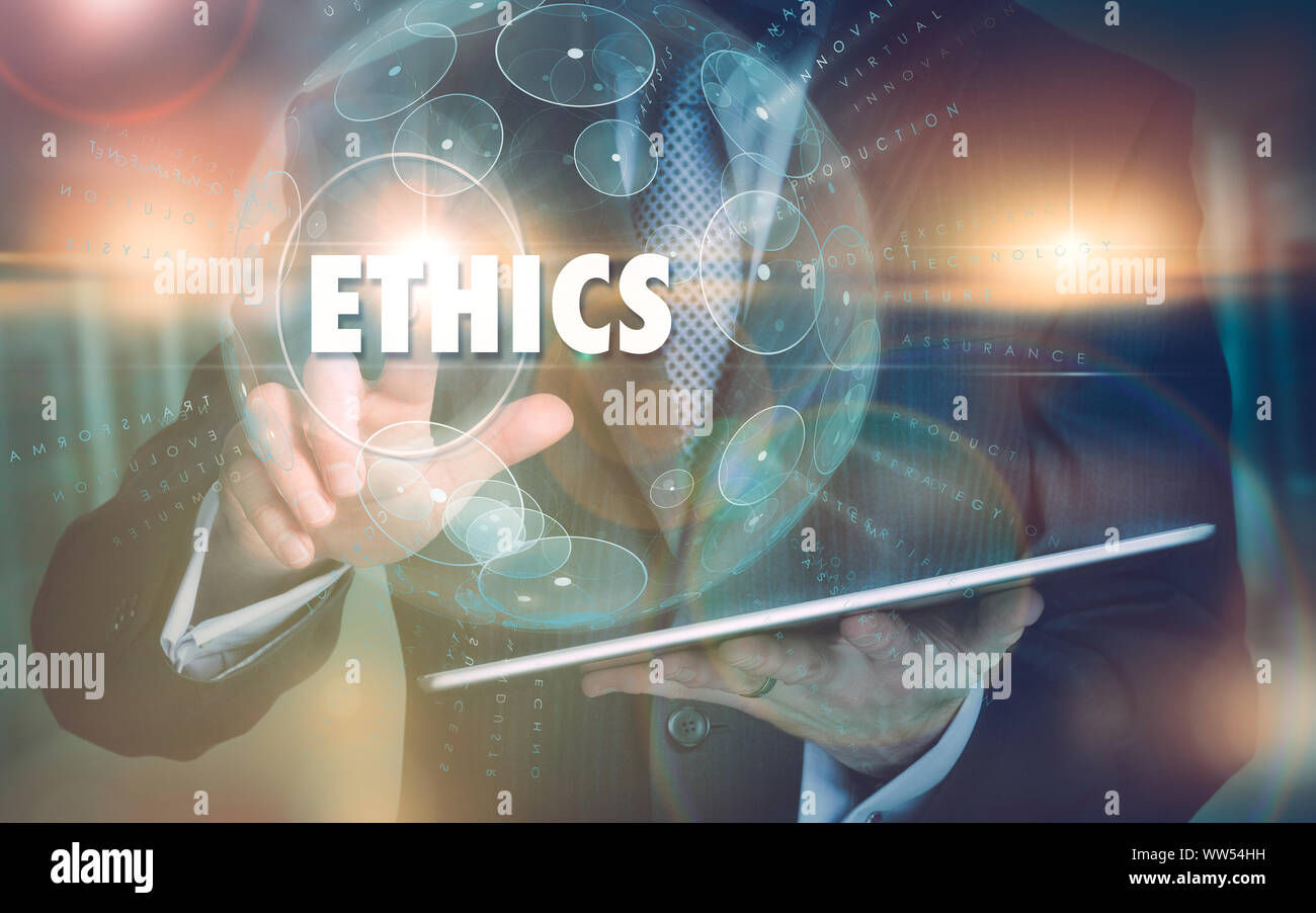 A hand selecting a Ethics business concept on a futuristic computer ...