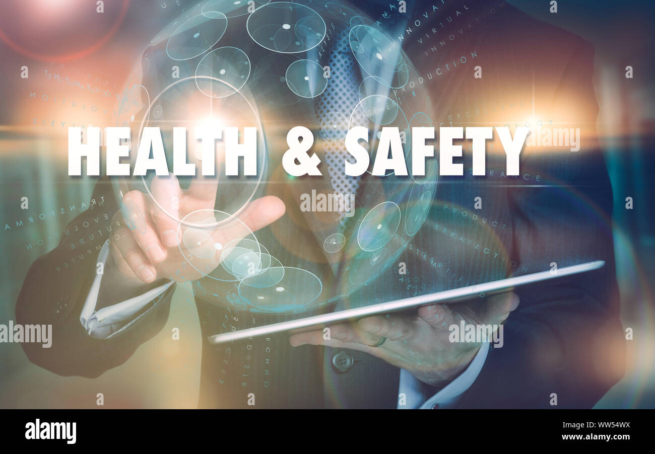 A hand selecting a Health and Safety business concept on a futuristic ...