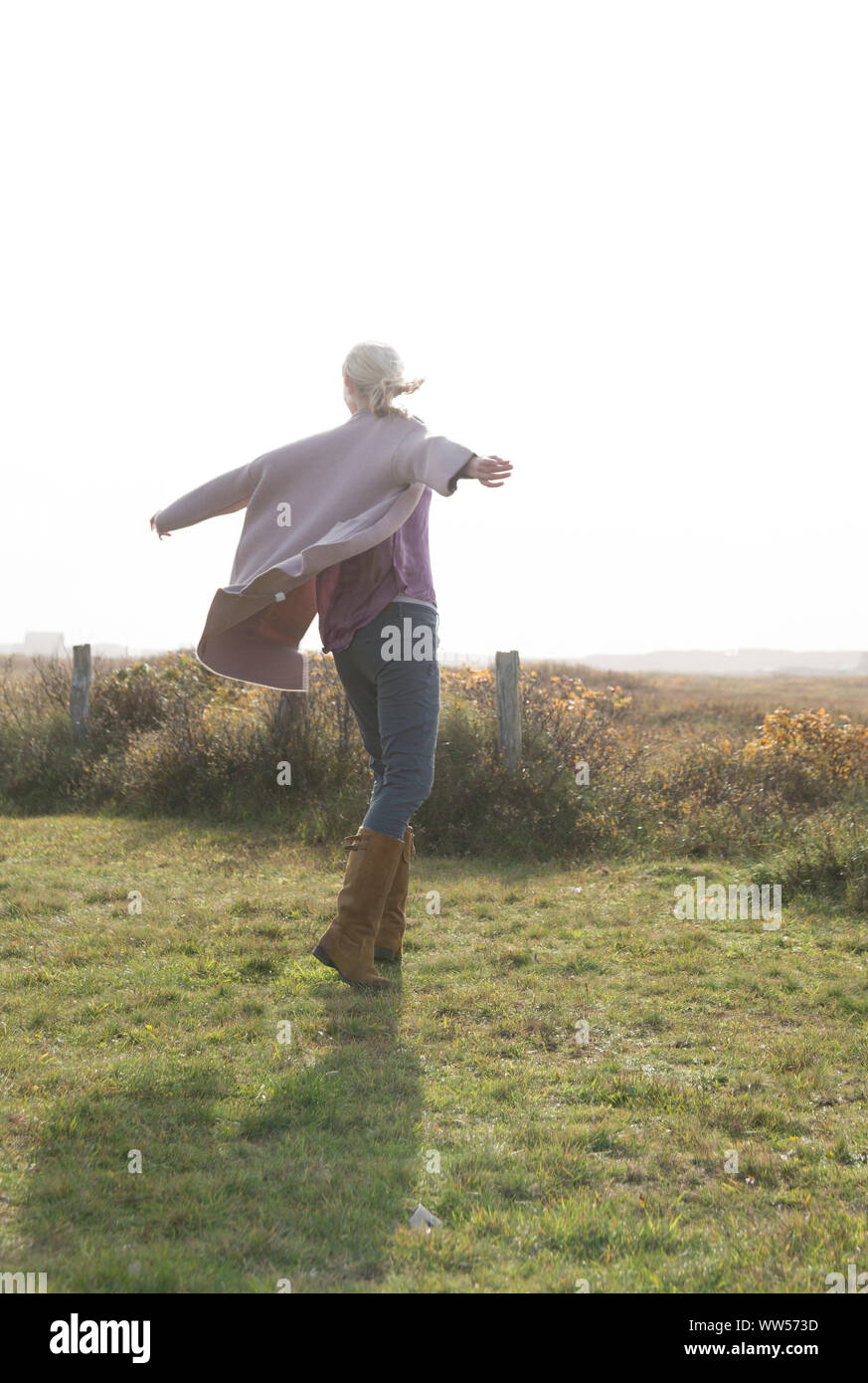 Woman coat back view turning hi-res stock photography and images - Alamy