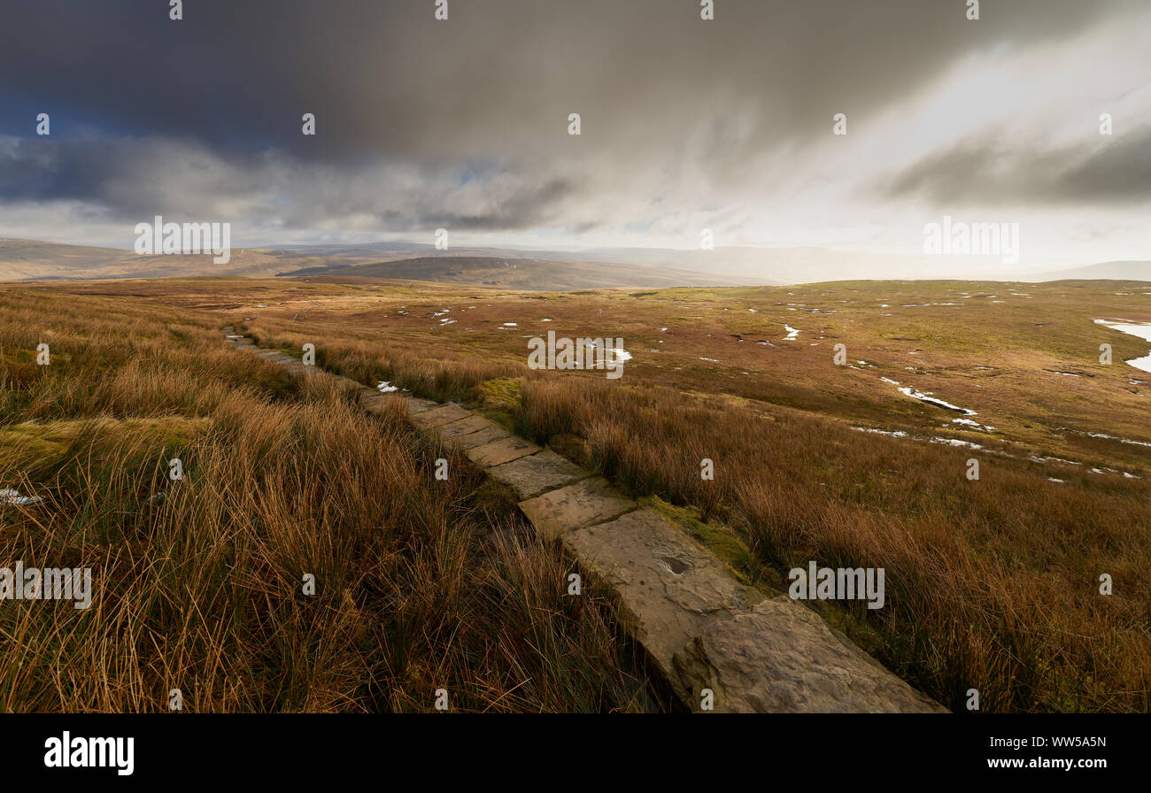 The stone path winding it's way through Blea Moor to the summit of ...