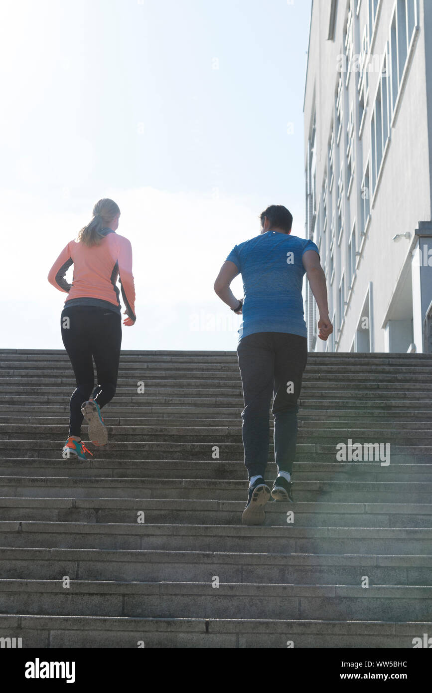 Running up stairs hi-res stock photography and images - Alamy