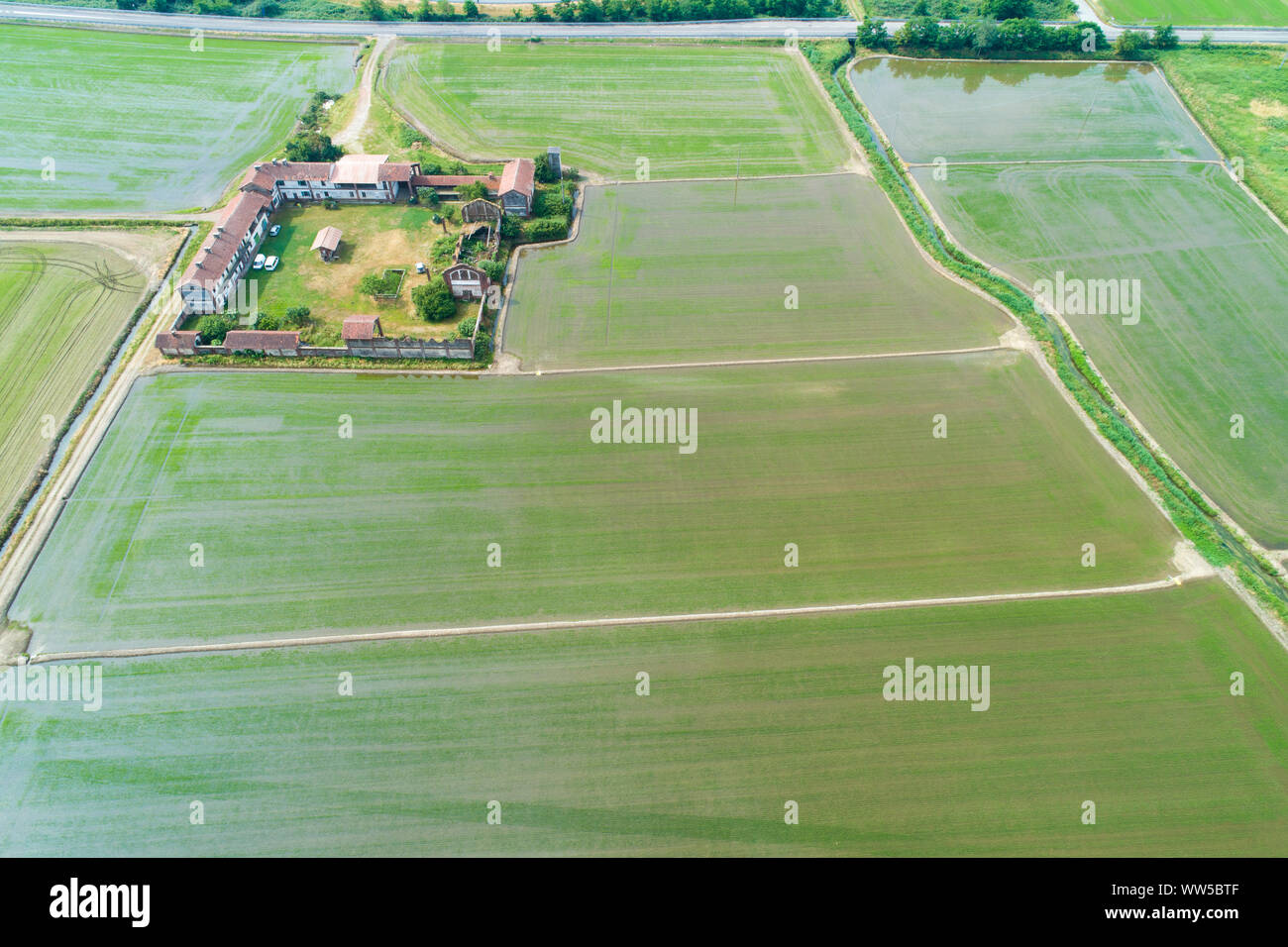 Flooded fields for rice cultivation and ancient farm viewed from above ...