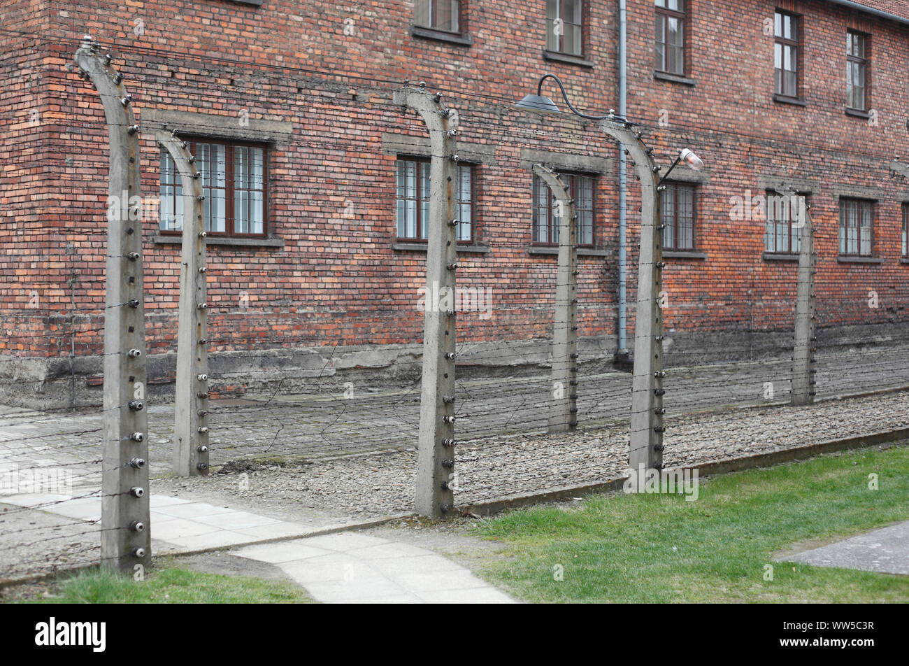 Electric barbed wire fence with barracks, death camp Auschwitz I ...