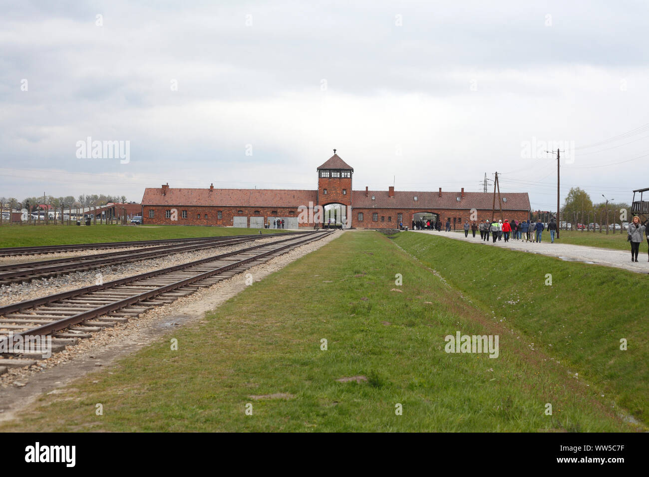 Gate, main guard and access rails, death camp Auschwitz II-Birkenau ...