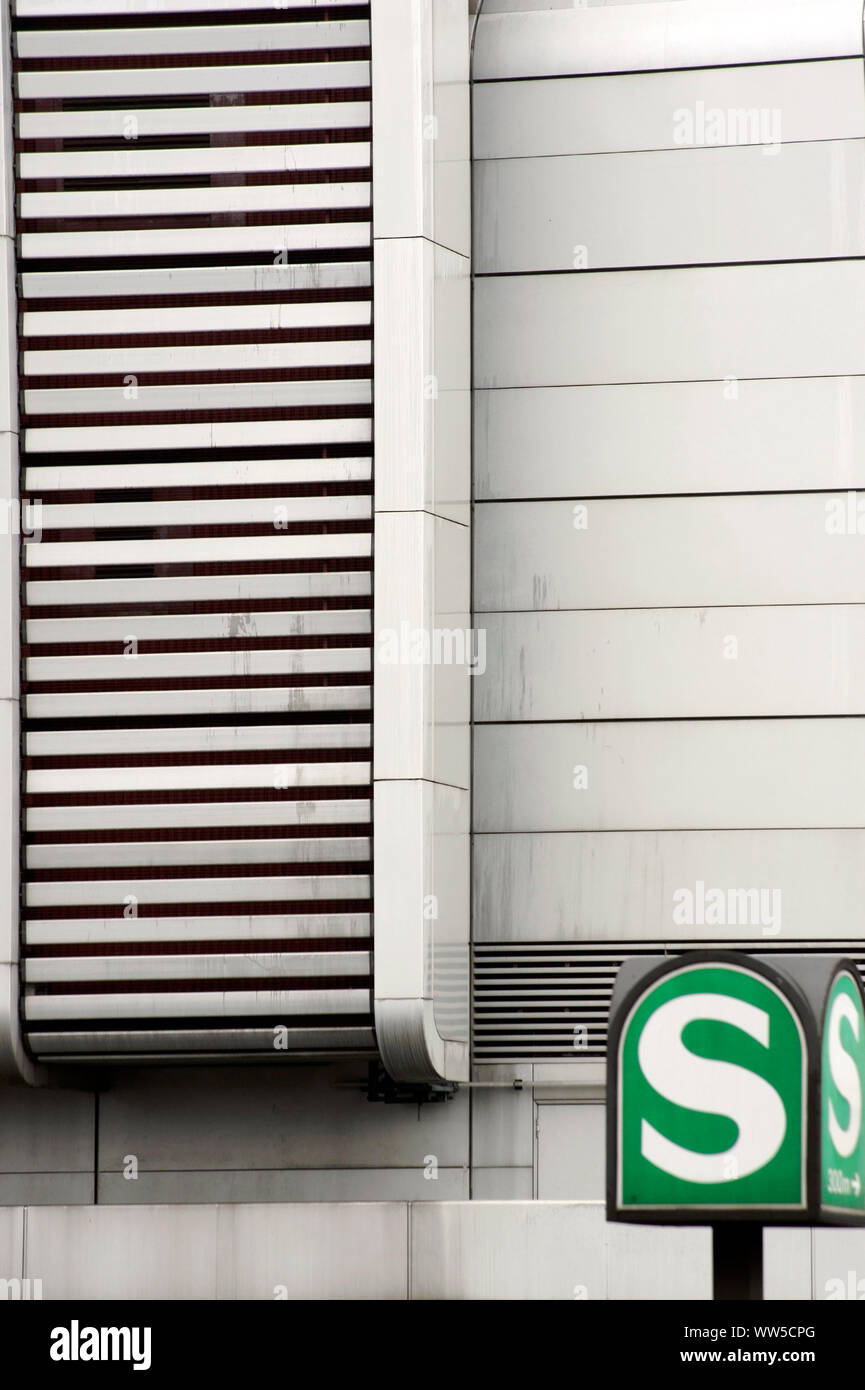 A green nostalgic streetcar sign standing in front of a striking facade ...