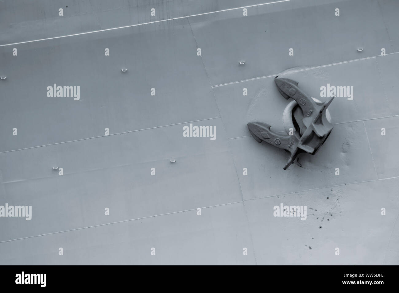 A ship wall from metal plates with an anchor Stock Photo - Alamy