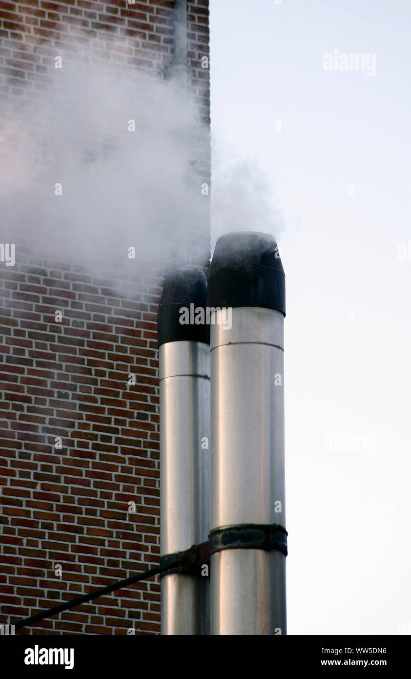Photography of a smoking smokestack from stainless steel hi-res stock ...