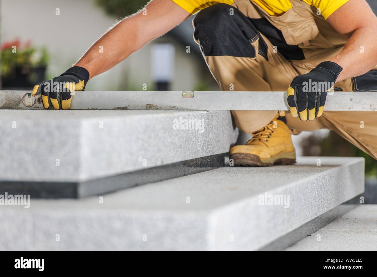 Construction Contractor Checking Stairs Levels Using Large Spirit Level ...